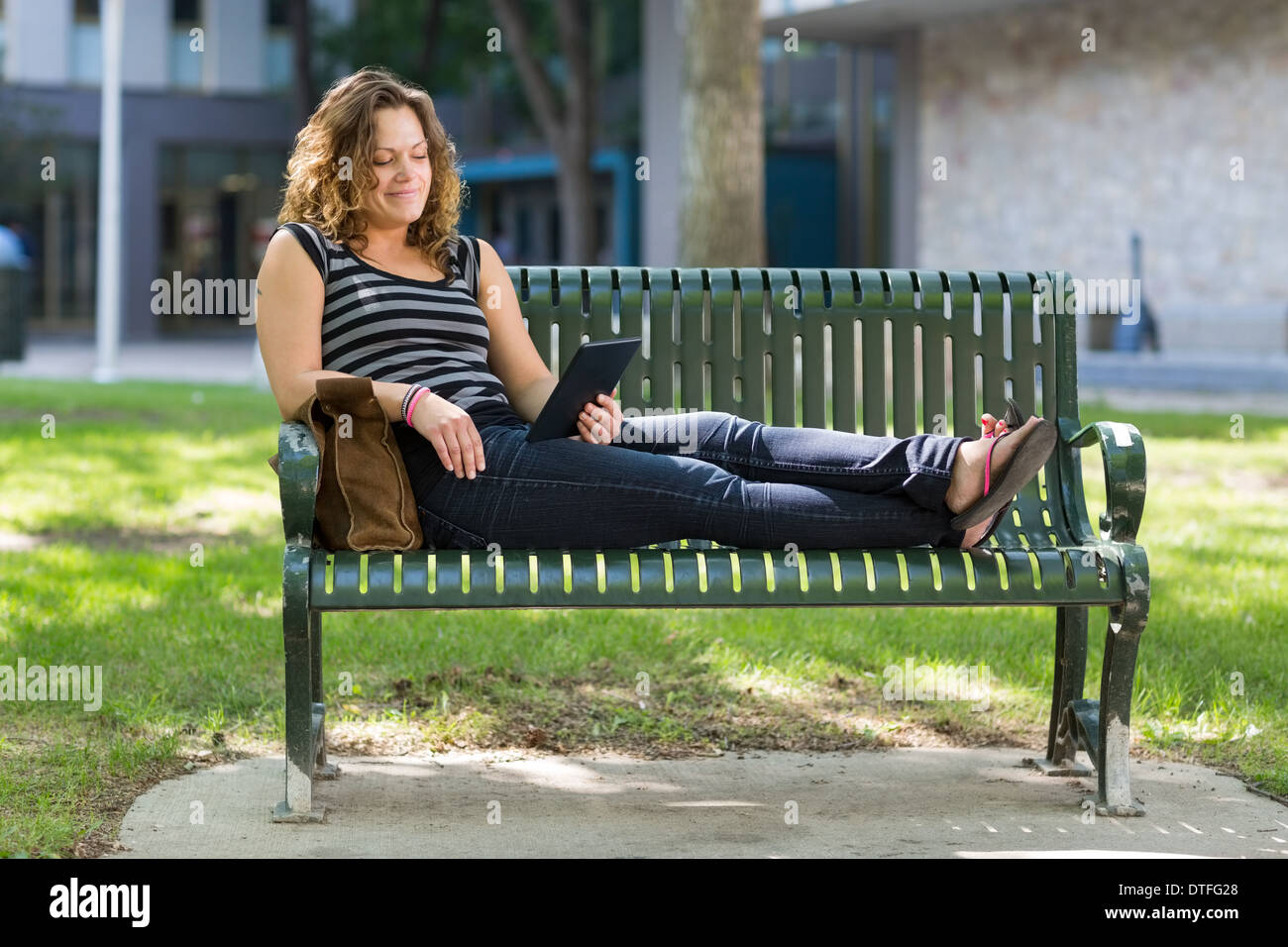 Female University Student Using Digital Tablet On Bench Stock Photo - Alamy