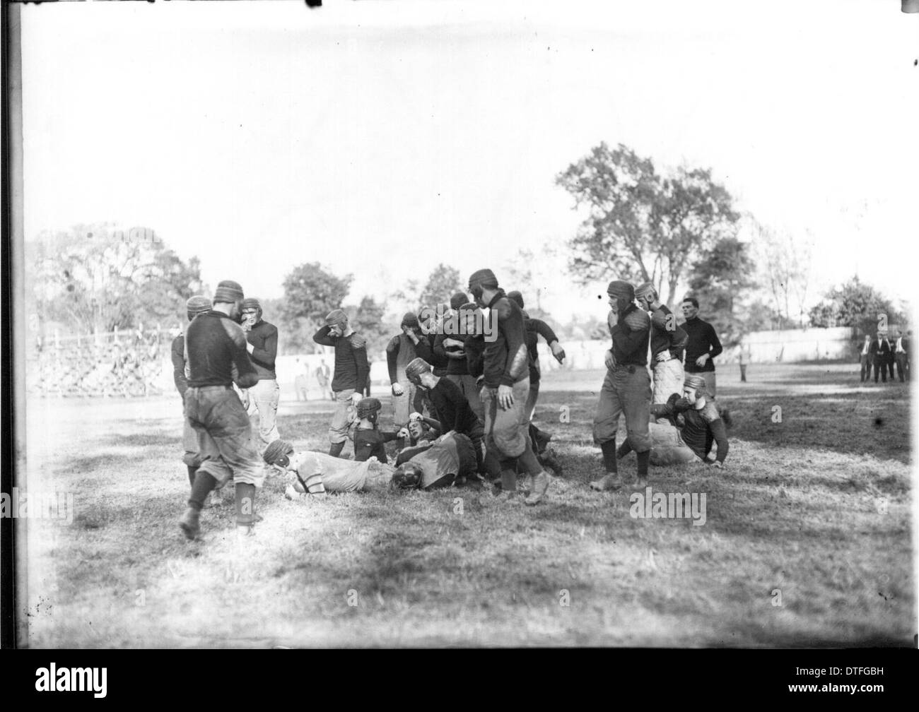 This historic photograph captures a moment from the 1910 football game ...