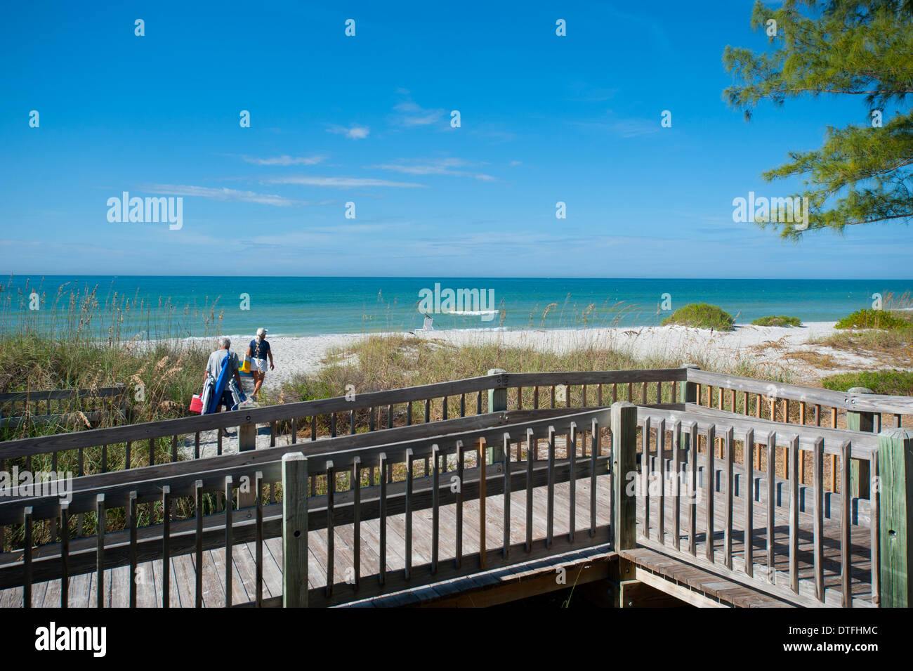 USA Florida Sarasota FL Longboat Key older mature couple walks on a ...