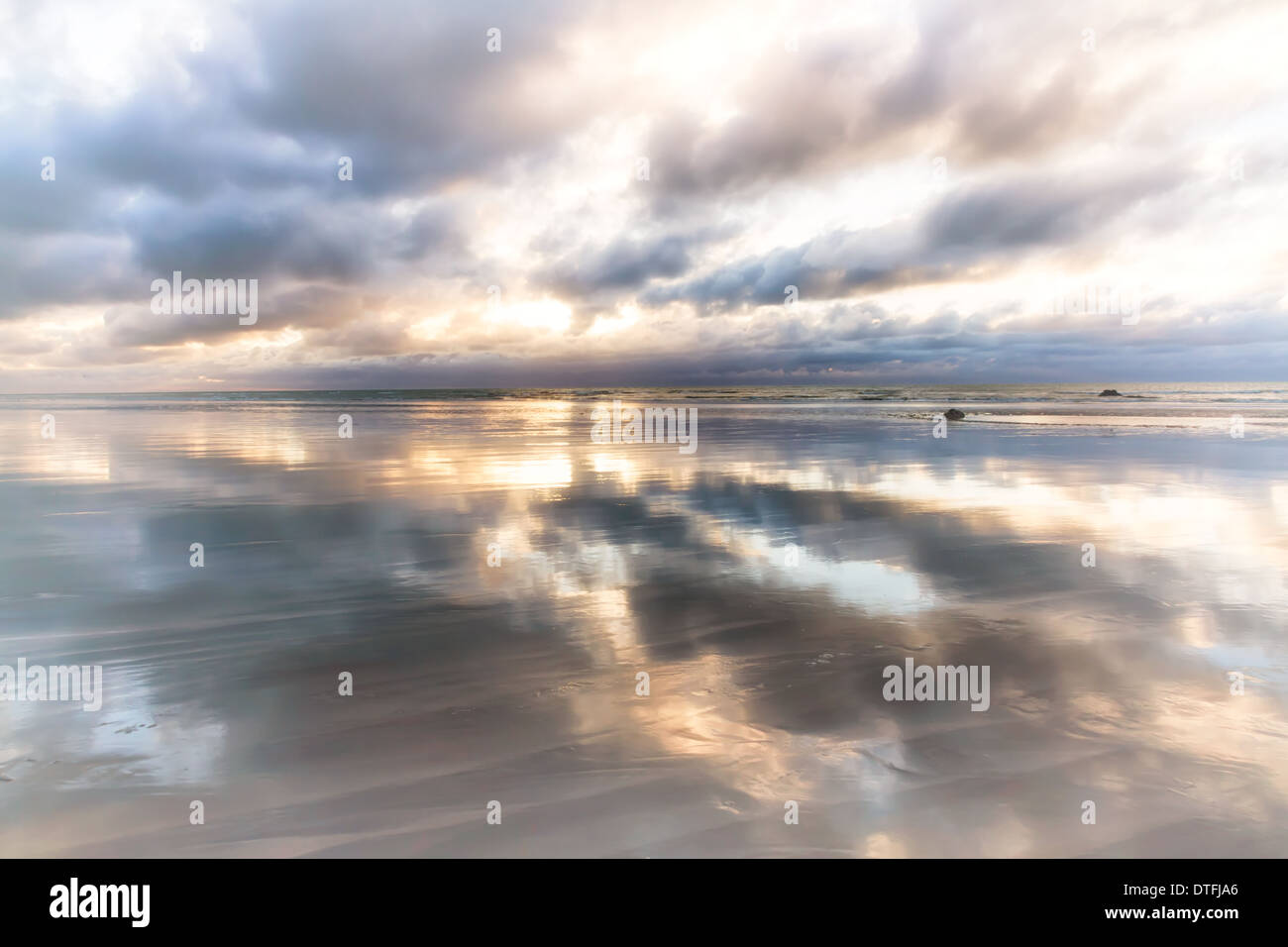 Beach sunset with cloudy sky and reflection at Veules-les-Roses ...