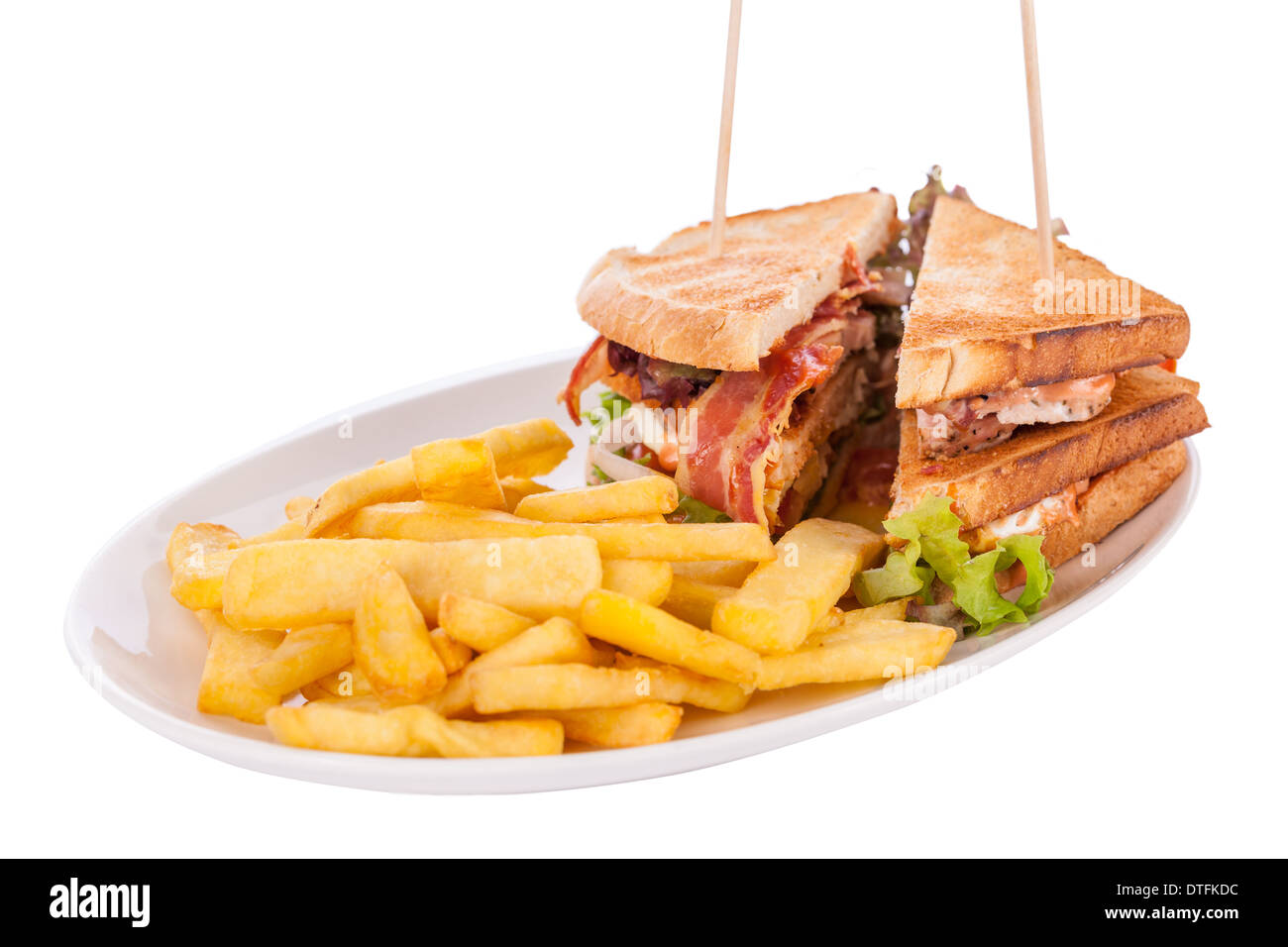 Club sandwich on toasted white bread with a meat filling served with ...