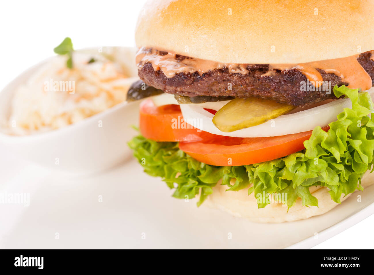 Tasty traditional cheeseburger with a ground beef patty topped with ...