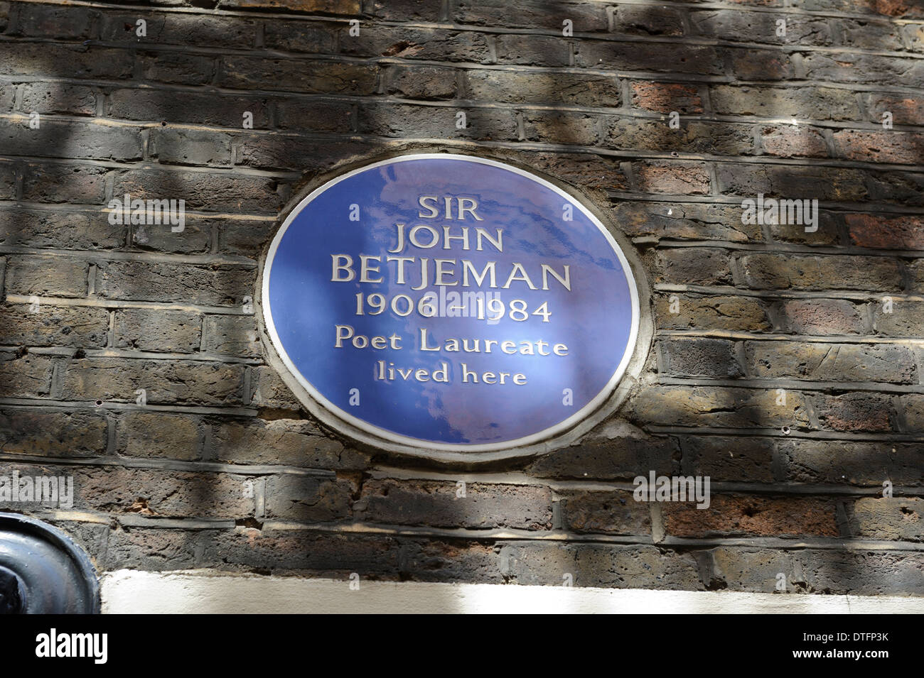 Blue plague of Sir John Betjeman on display, London, England, United ...