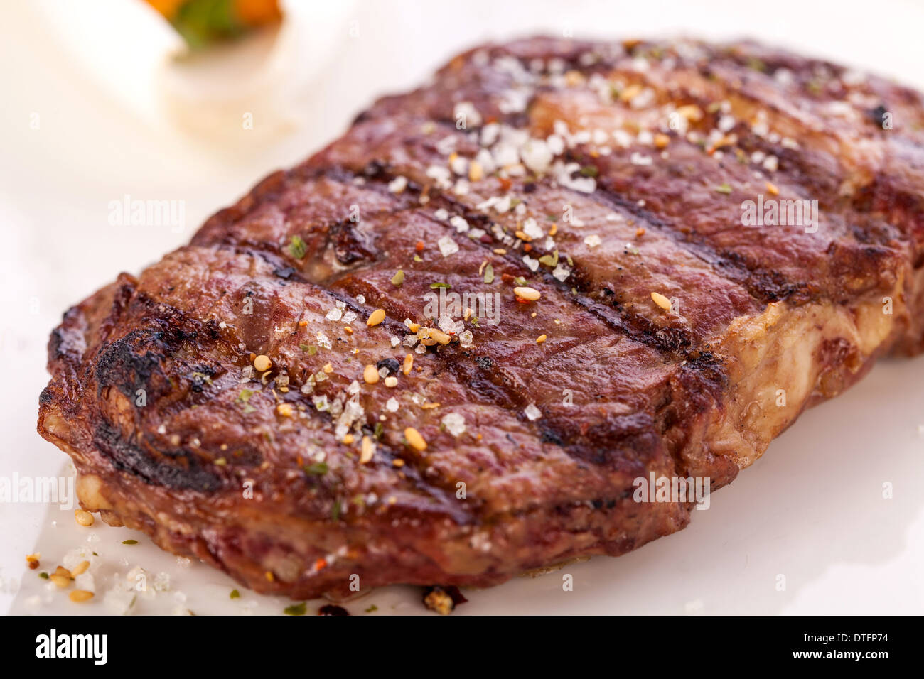Delicious trimmed lean portion of thick grilled beef steak with ...