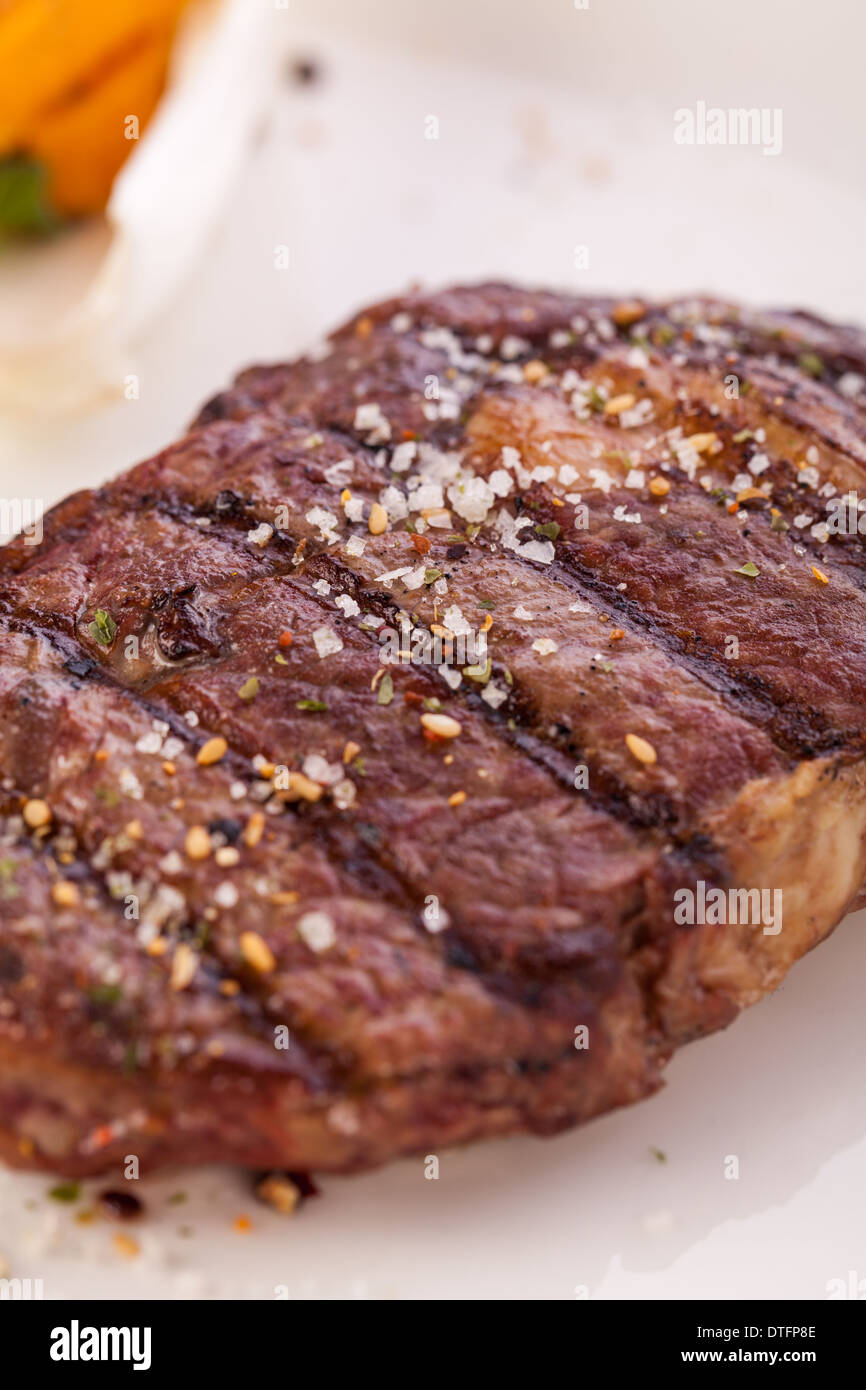 Delicious trimmed lean portion of thick grilled beef steak with ...