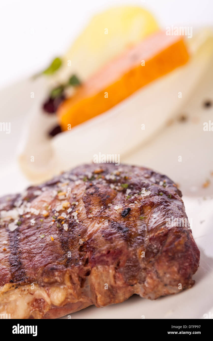 Delicious trimmed lean portion of thick grilled beef steak with ...