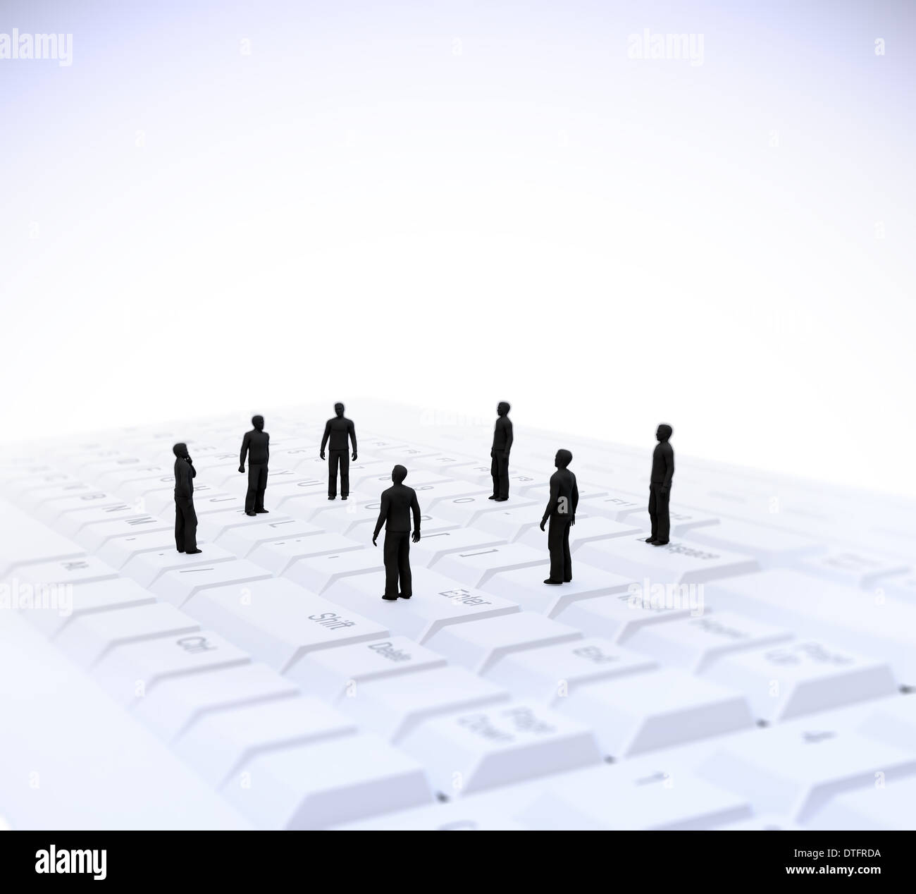 Tiny people standing on a computer keyboard Stock Photo - Alamy