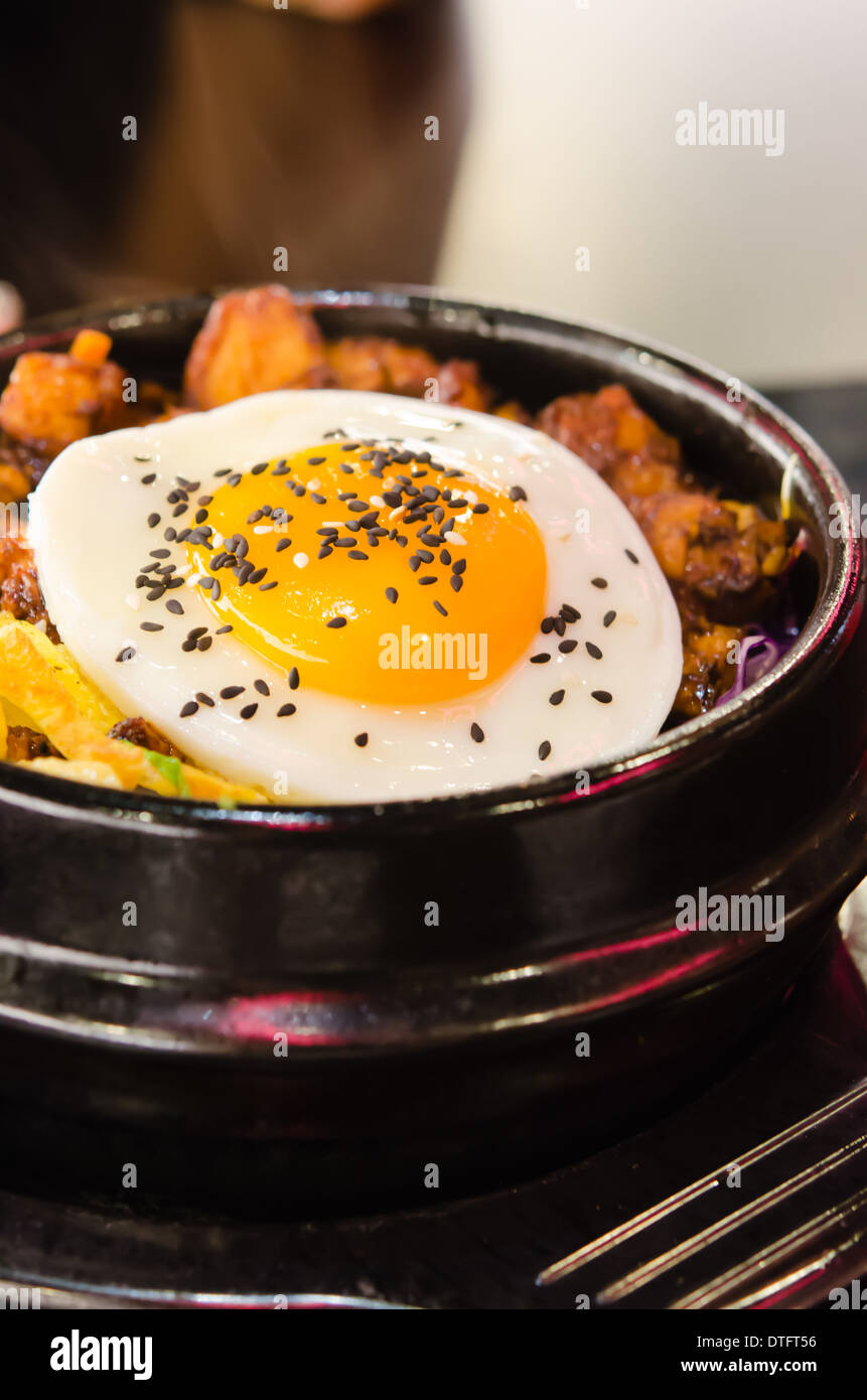 bibimbap in a heated stone bowl , korean style food Stock Photo - Alamy