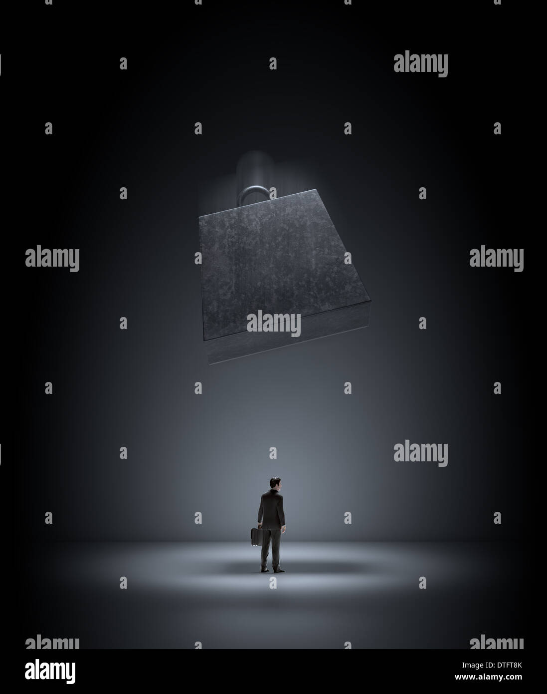 A heavy metal wieght falling on a business man Stock Photo - Alamy