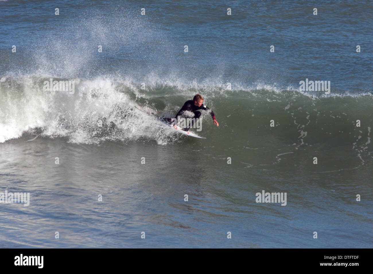 Crouching Surfer, Porthgwidden Beach, St. Ives, Cornwall Stock Photo ...