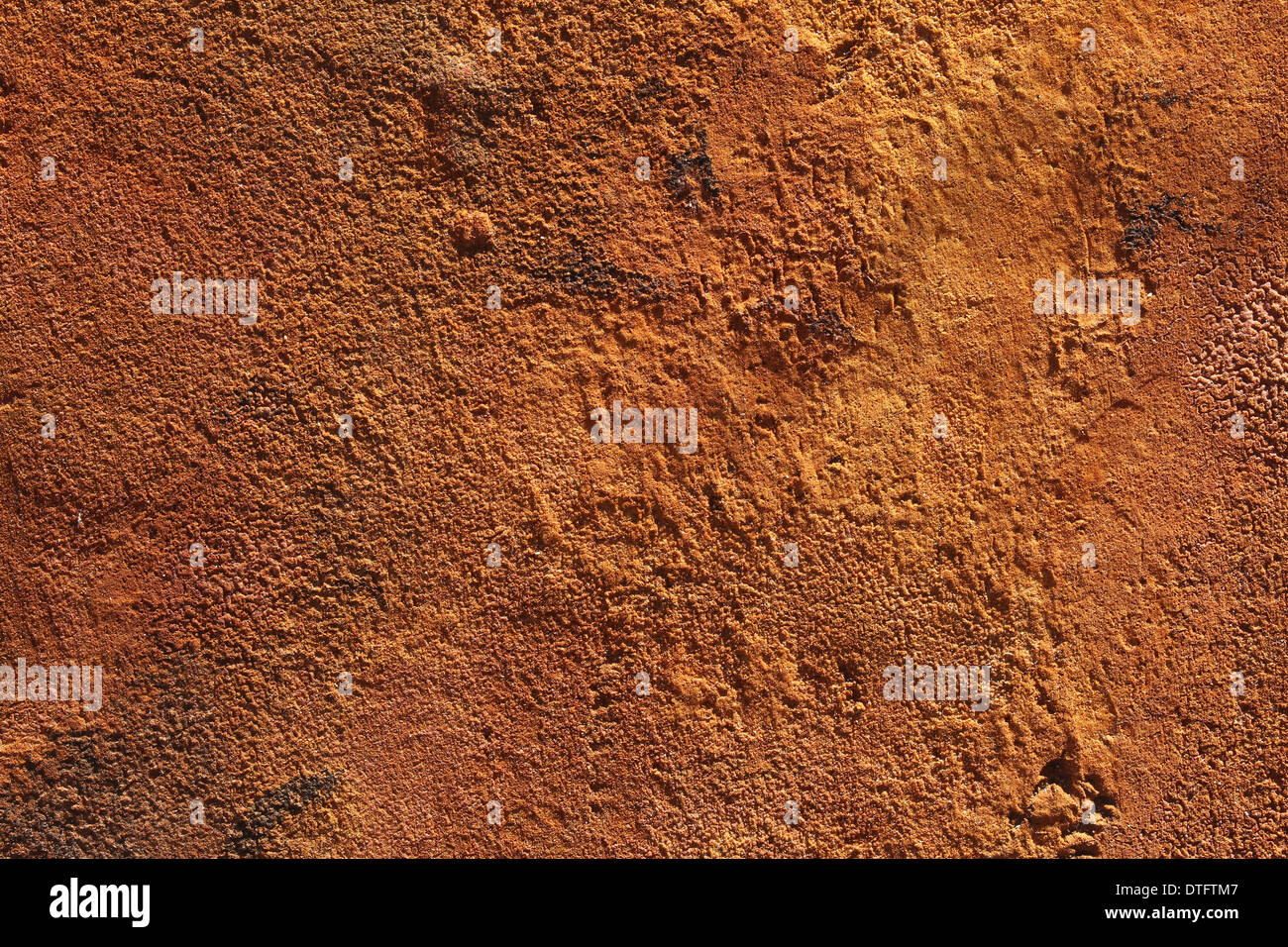 Weathered ginger stone wall Stock Photo - Alamy