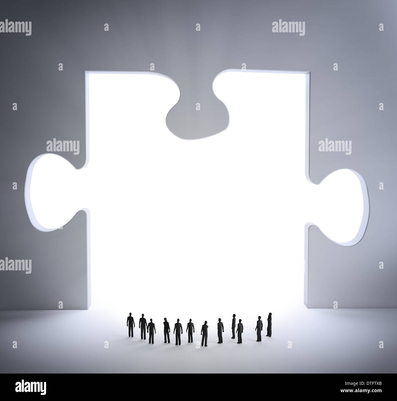Tiny people looking and a jigsaw puzzle piece Stock Photo - Alamy