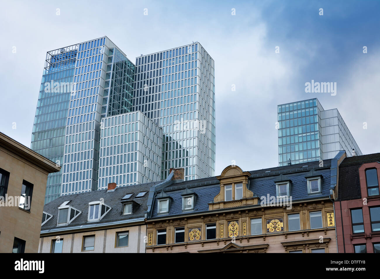 Modern office buildings behind old houses Stock Photo - Alamy