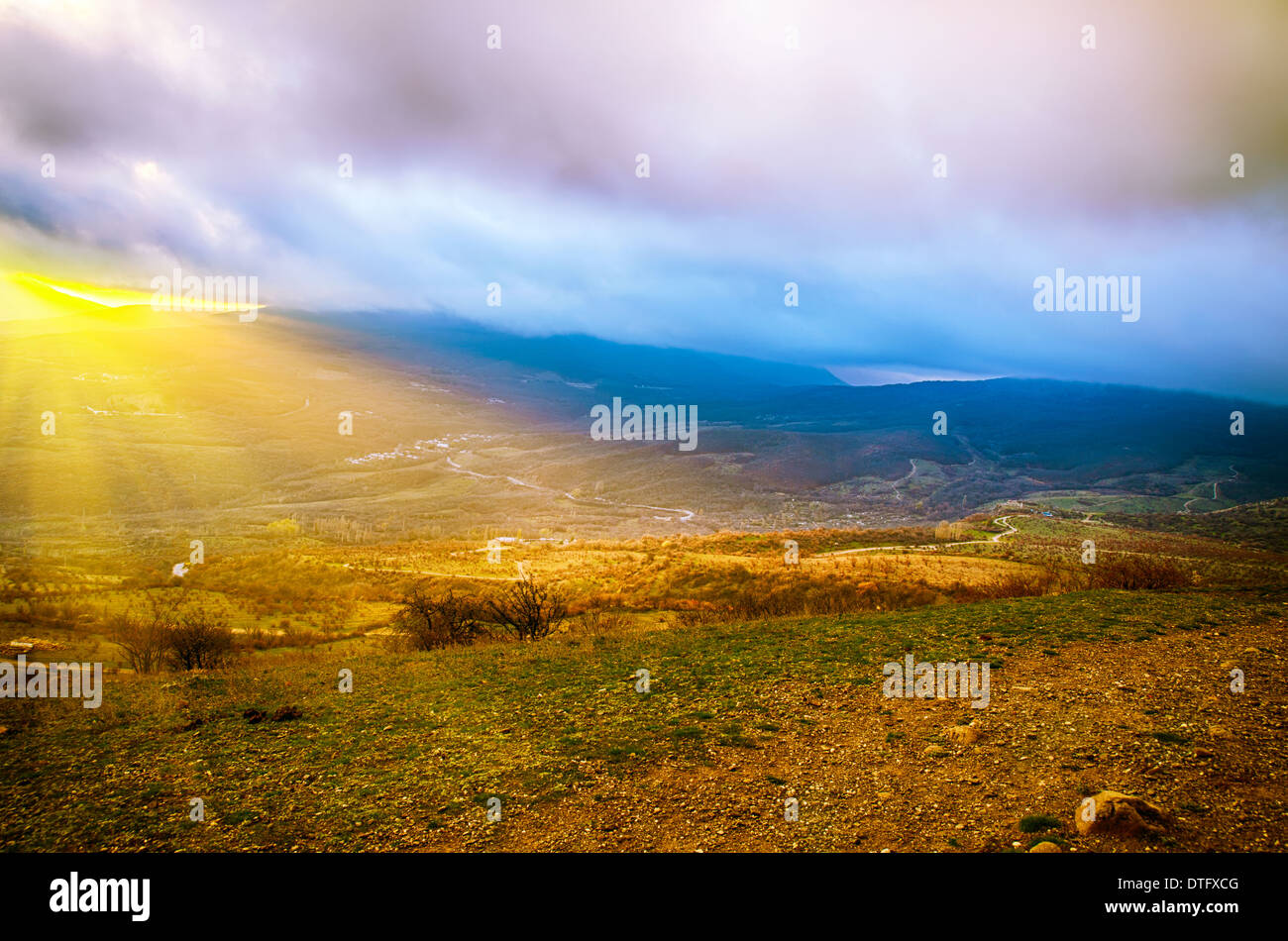 Rural landscape with sun rays Stock Photo - Alamy