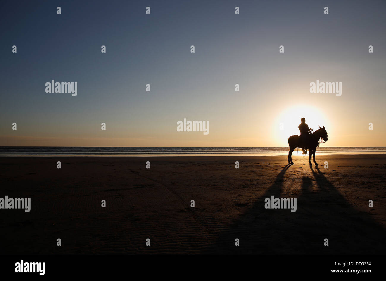 Man horse silhouette Pacific coast beach sunset, Mechapa Nicaragua ...