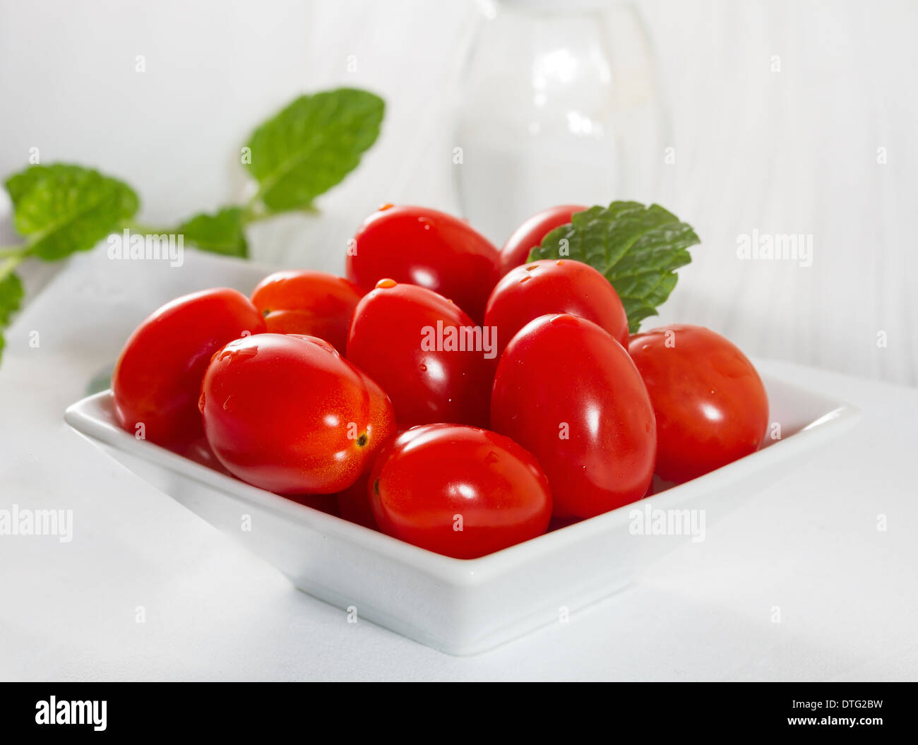 Mini tomatoes on a platter Stock Photo - Alamy