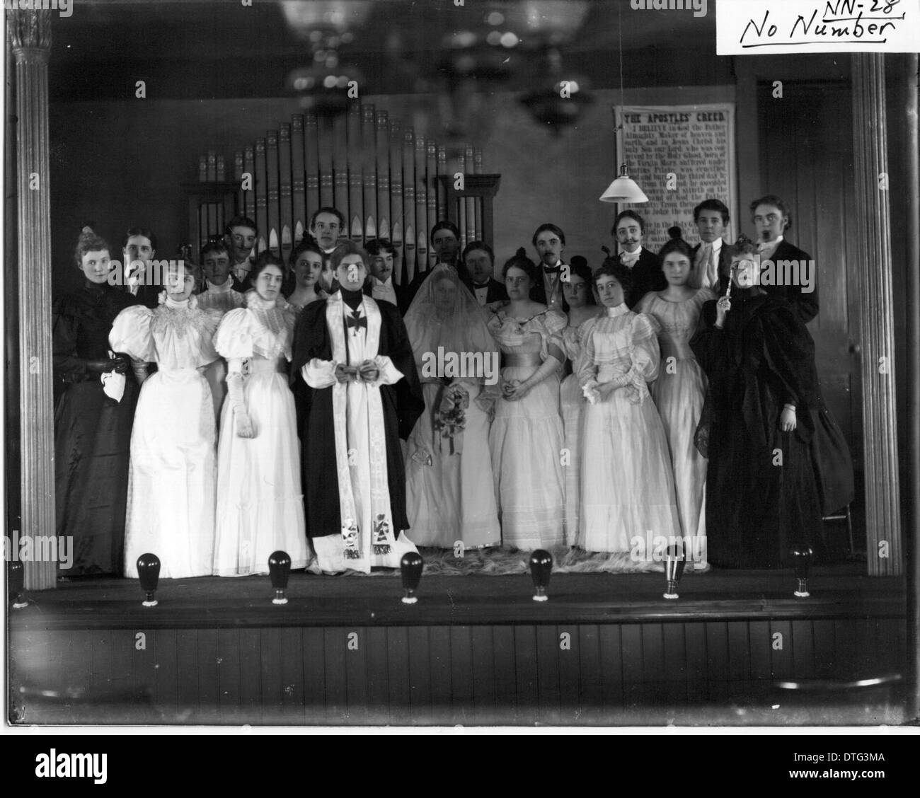 A historic photograph of a theatre troupe in costume, capturing actors ...