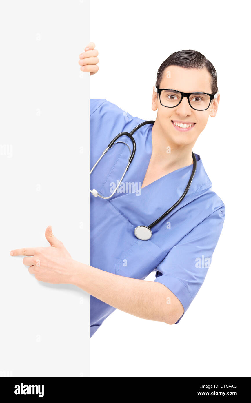 Male doctor pointing on a blank panel Stock Photo - Alamy