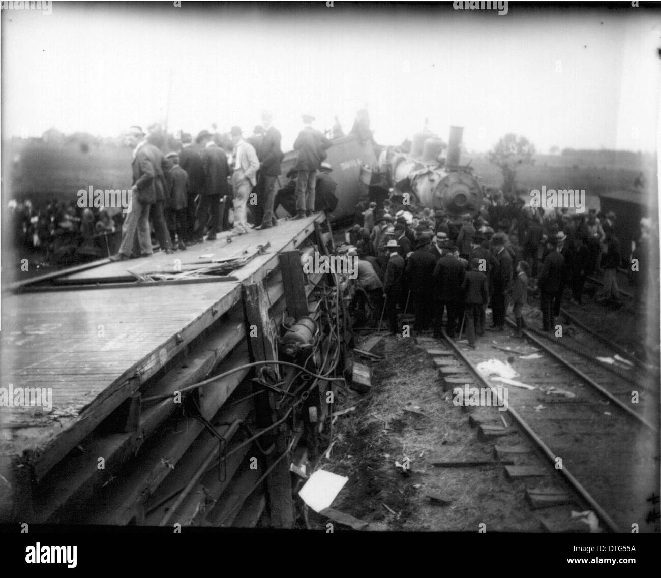 A photograph from around 1900 depicting a railroad accident scene with ...
