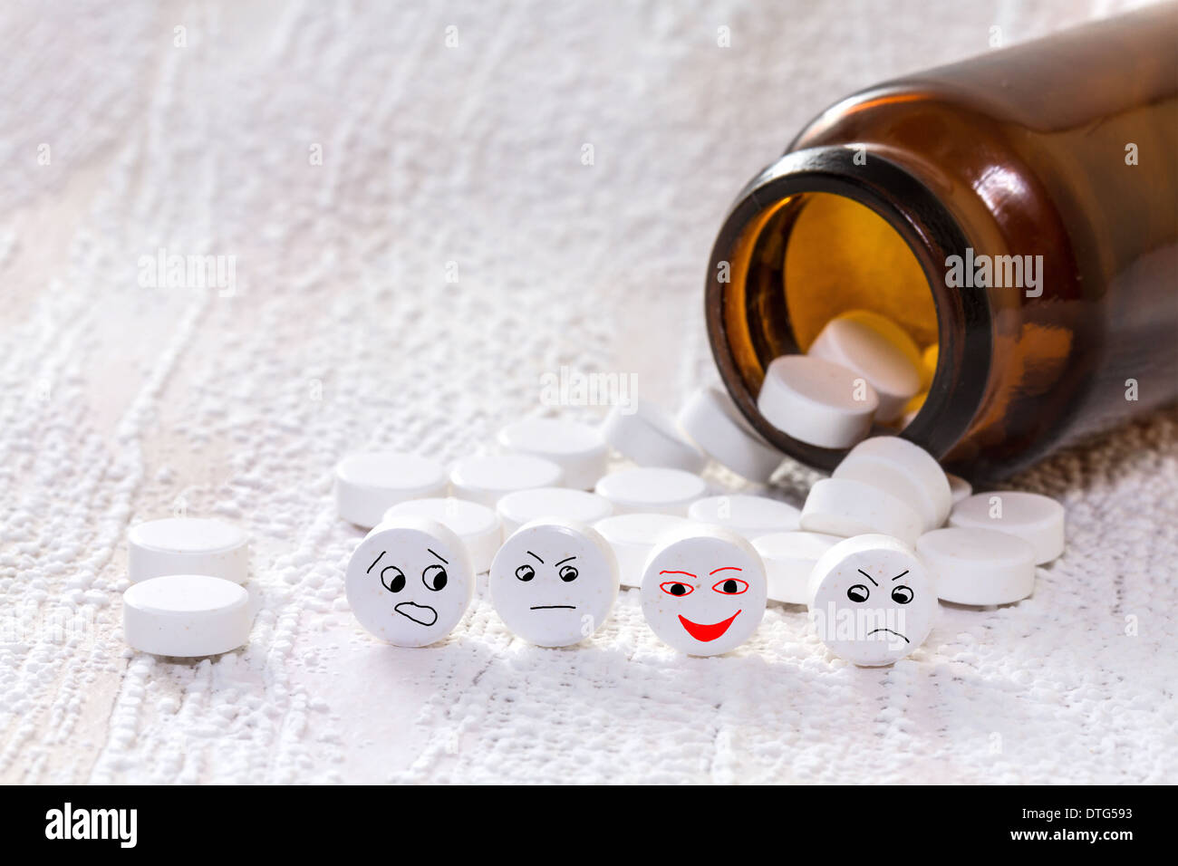 Tablets with smiley face in medical bottle Stock Photo - Alamy