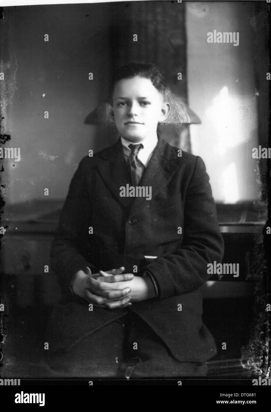 A vintage portrait photograph of a young boy, representing the ...