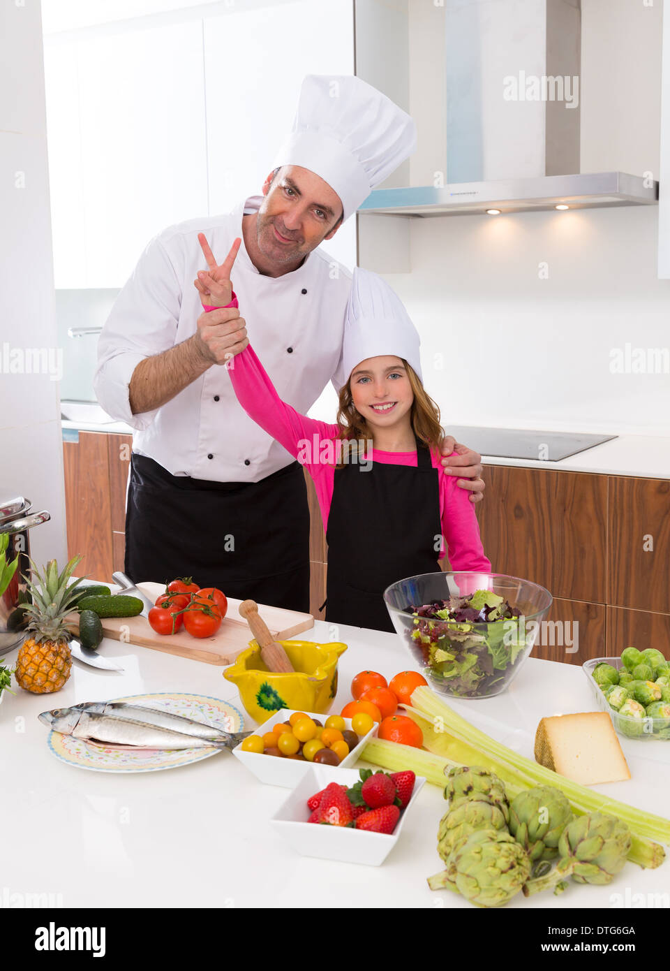 Junior chef and master teacher award winner in a cooking contest Stock ...