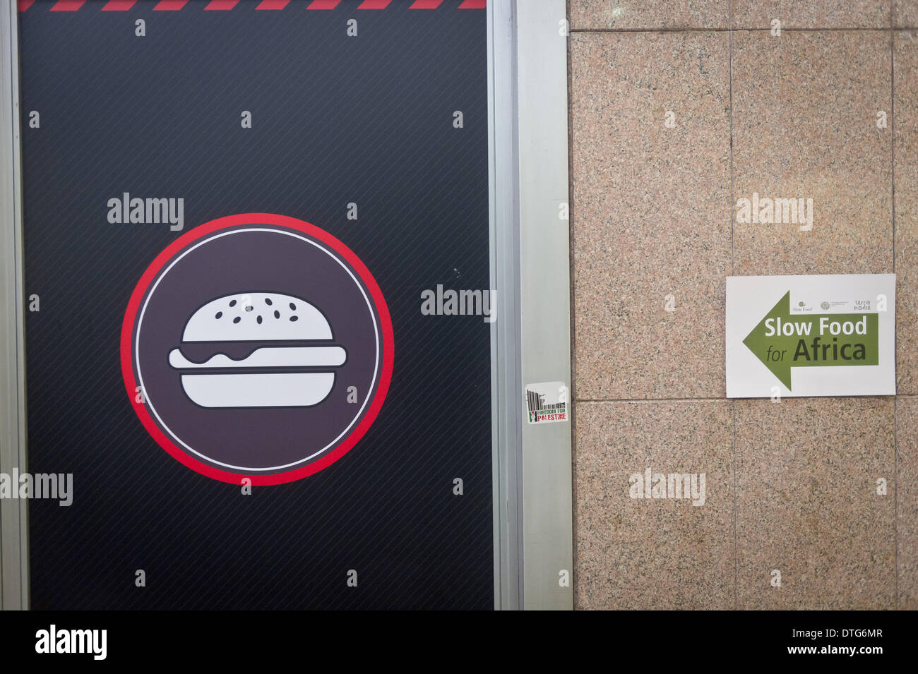 Milan, Italy. 17th Feb, 2014. The banner of slow food vs Fast Food logo ...