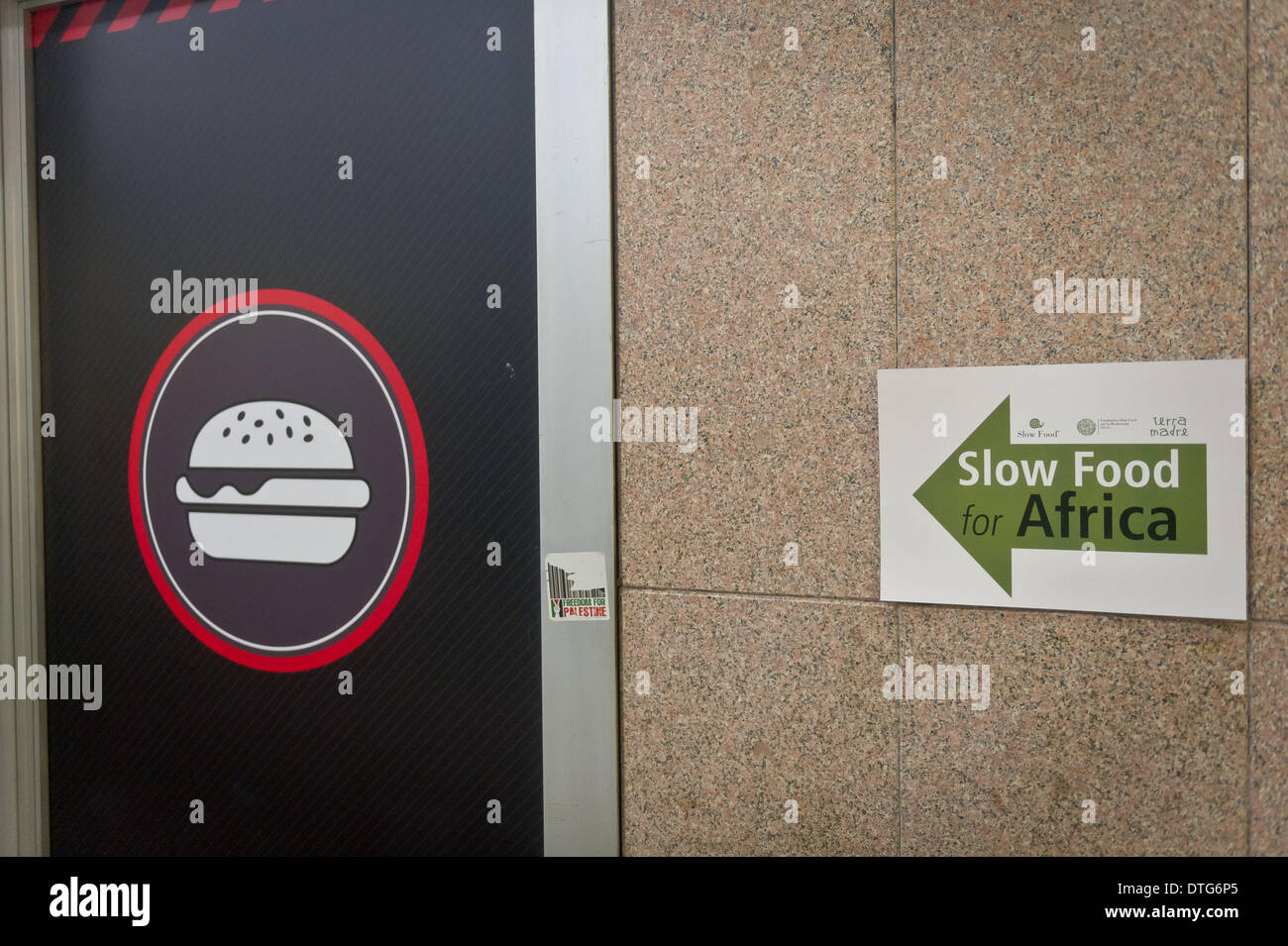 Milan, Italy. 17th Feb, 2014. The banner of slow food vs Fast Food logo ...