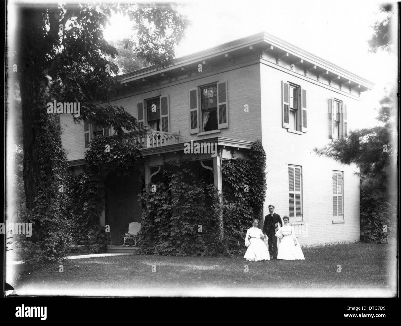 This historical photograph from 1904 shows a family posing in front of ...