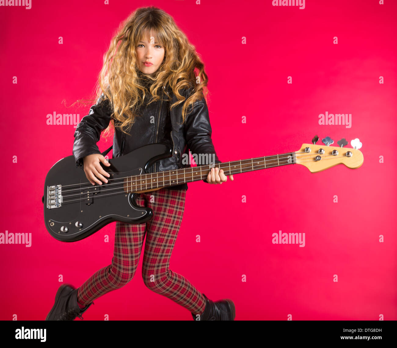 Girl playing bass guitar hi-res stock photography and images - Alamy