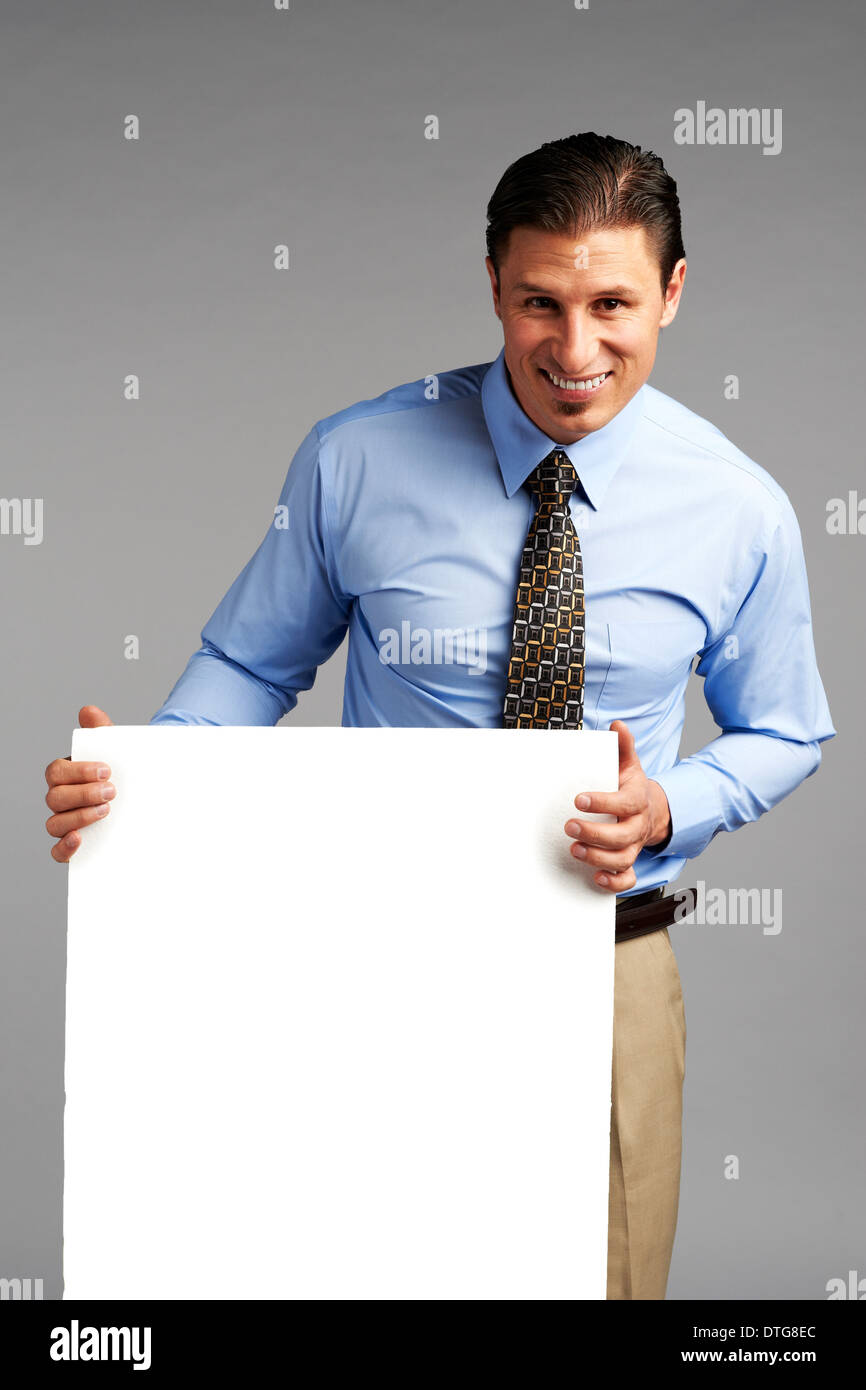 Business man holding white banner Stock Photo - Alamy