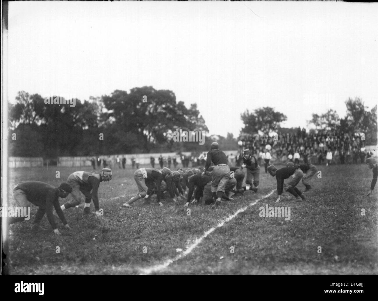 This historic image captures a moment from the 1911 football game ...