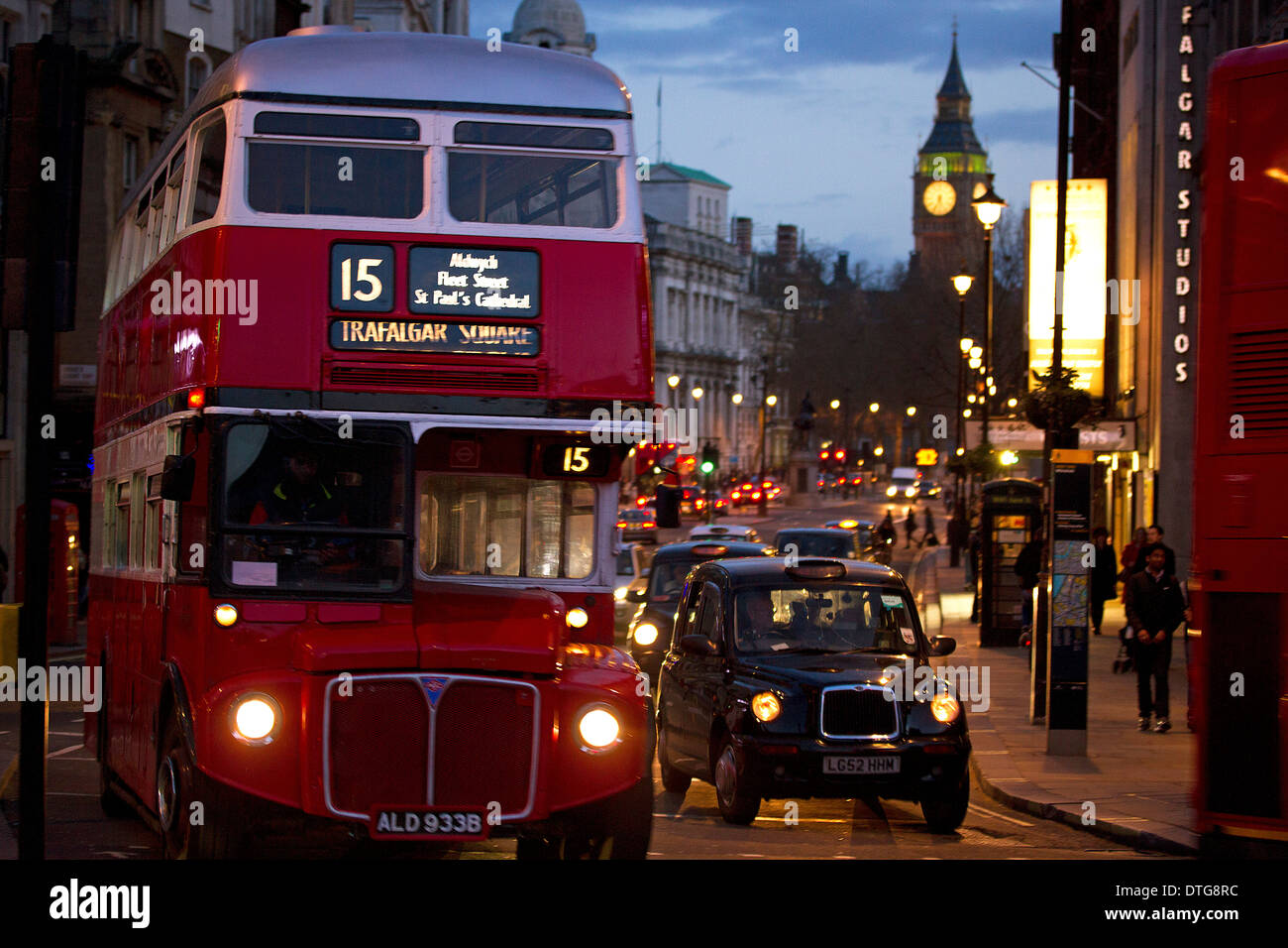 Bus and taxi in busy London traffic with London landmark Big Ben in ...