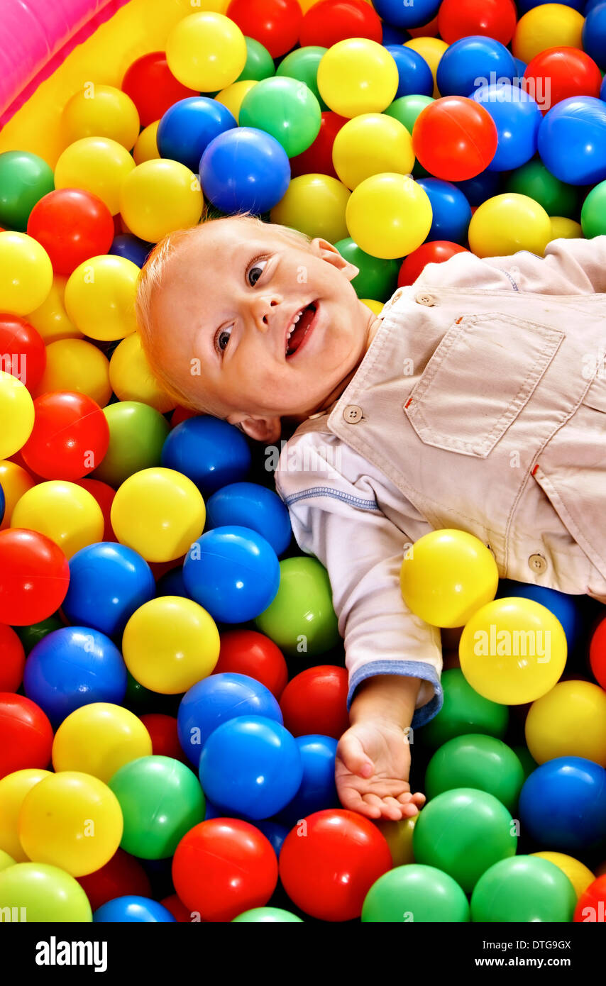 Little boy in colored ball Stock Photo - Alamy