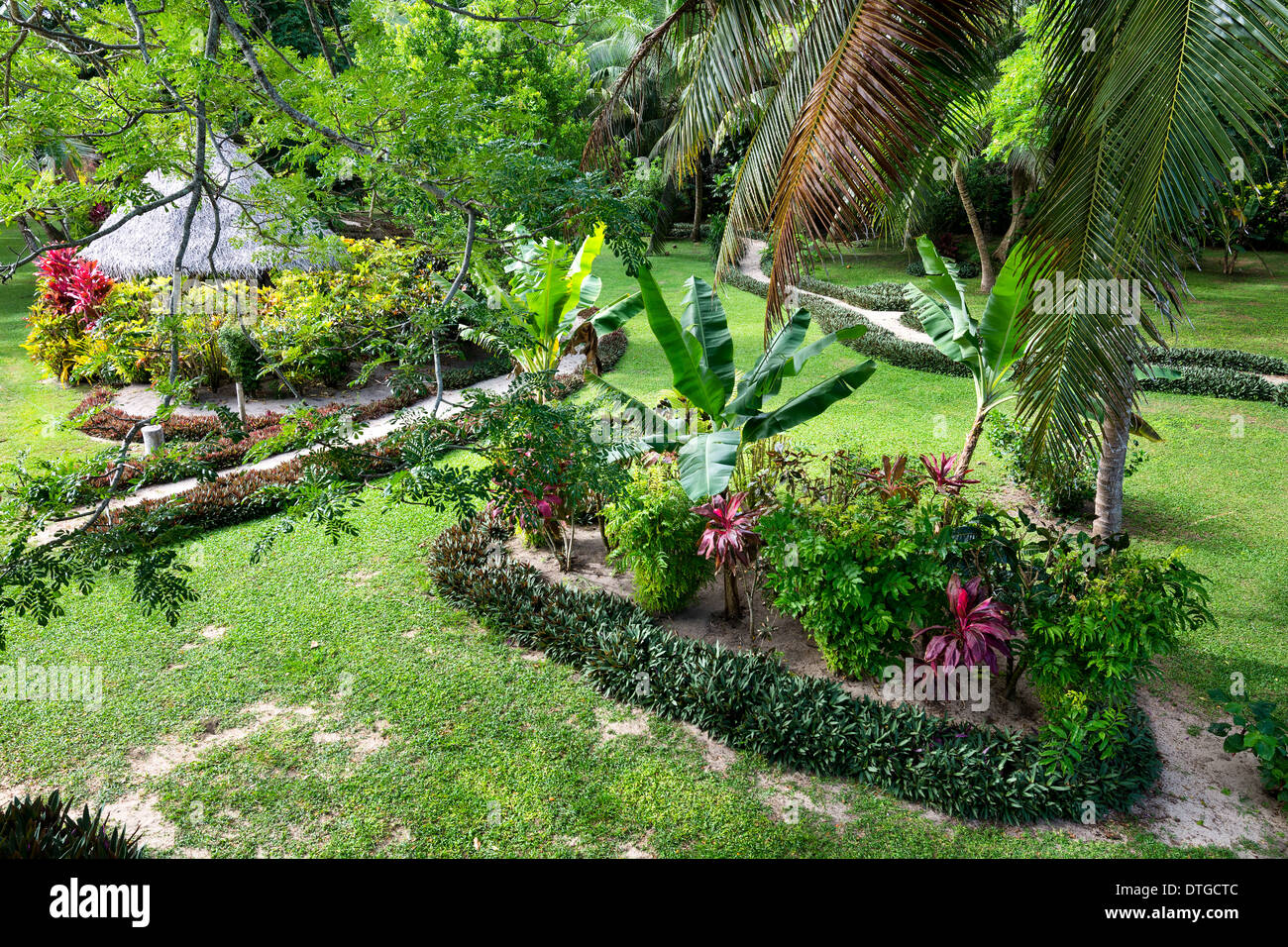 Lush garden grounds at a tropical resort in Asia shows the relaxing ...