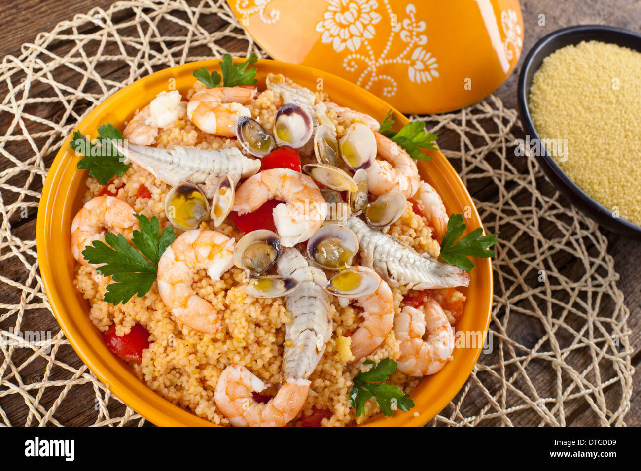 Traditional ethnic food: fish tajine with cous cous Stock Photo - Alamy