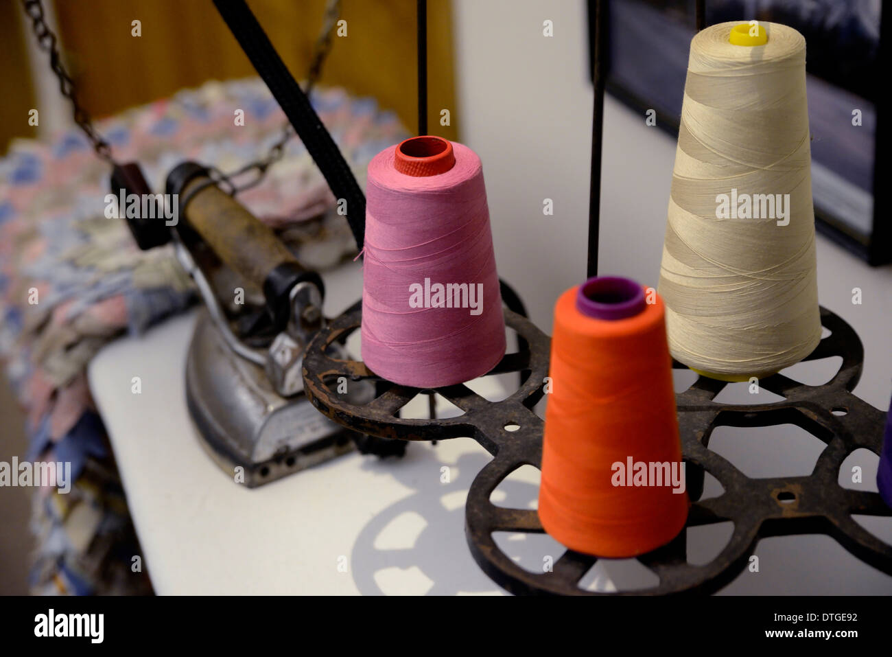 Antique thread spools and clothes iron seen in a restored vintage ...