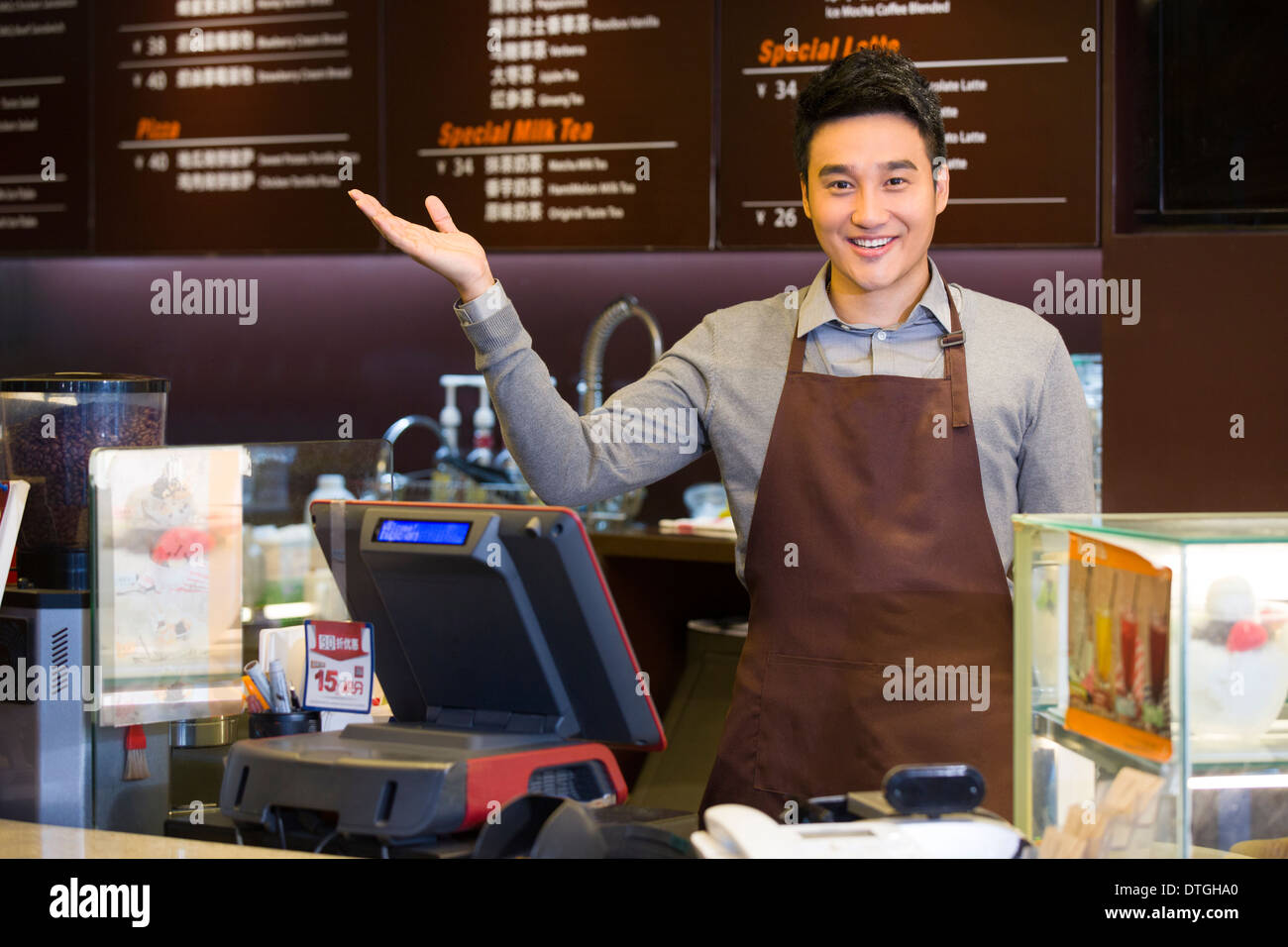 Portrait of male coffee store clerk Stock Photo - Alamy