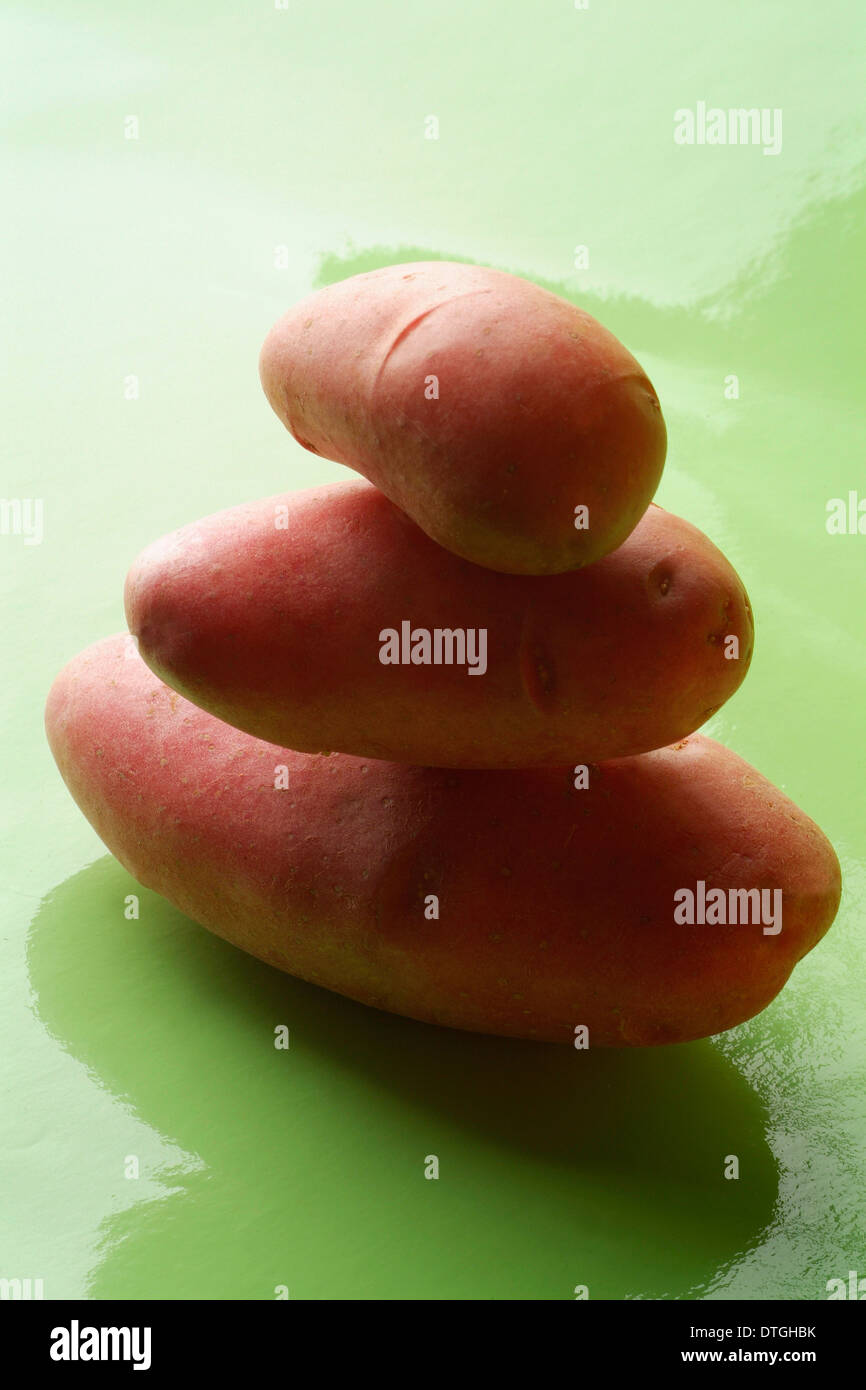 Three Roseval potatoes Stock Photo - Alamy