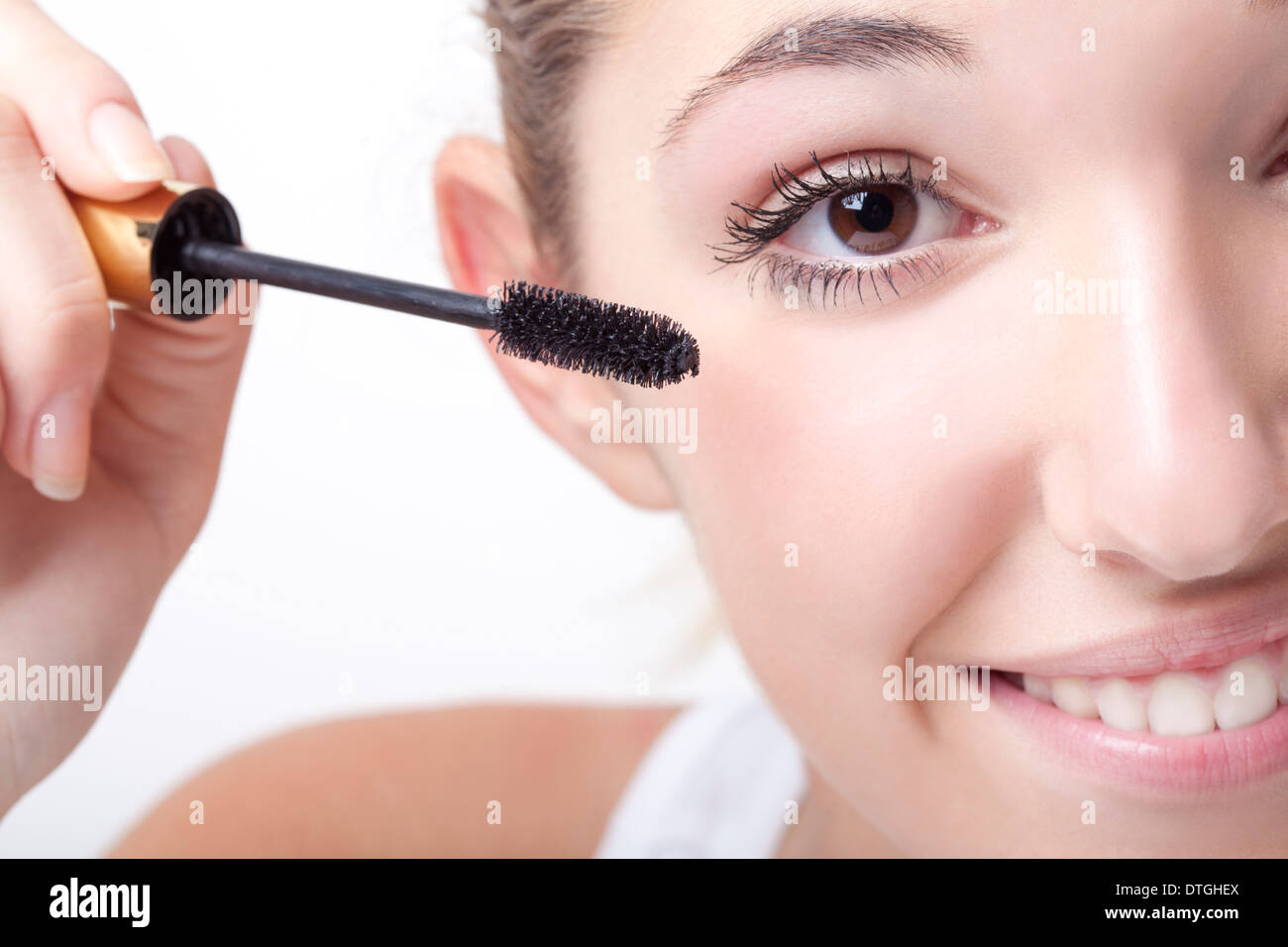 Girl applying mascara hi-res stock photography and images - Alamy