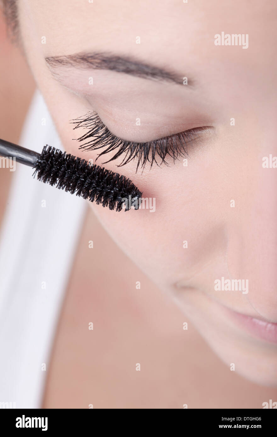 Girl applying mascara hi-res stock photography and images - Alamy