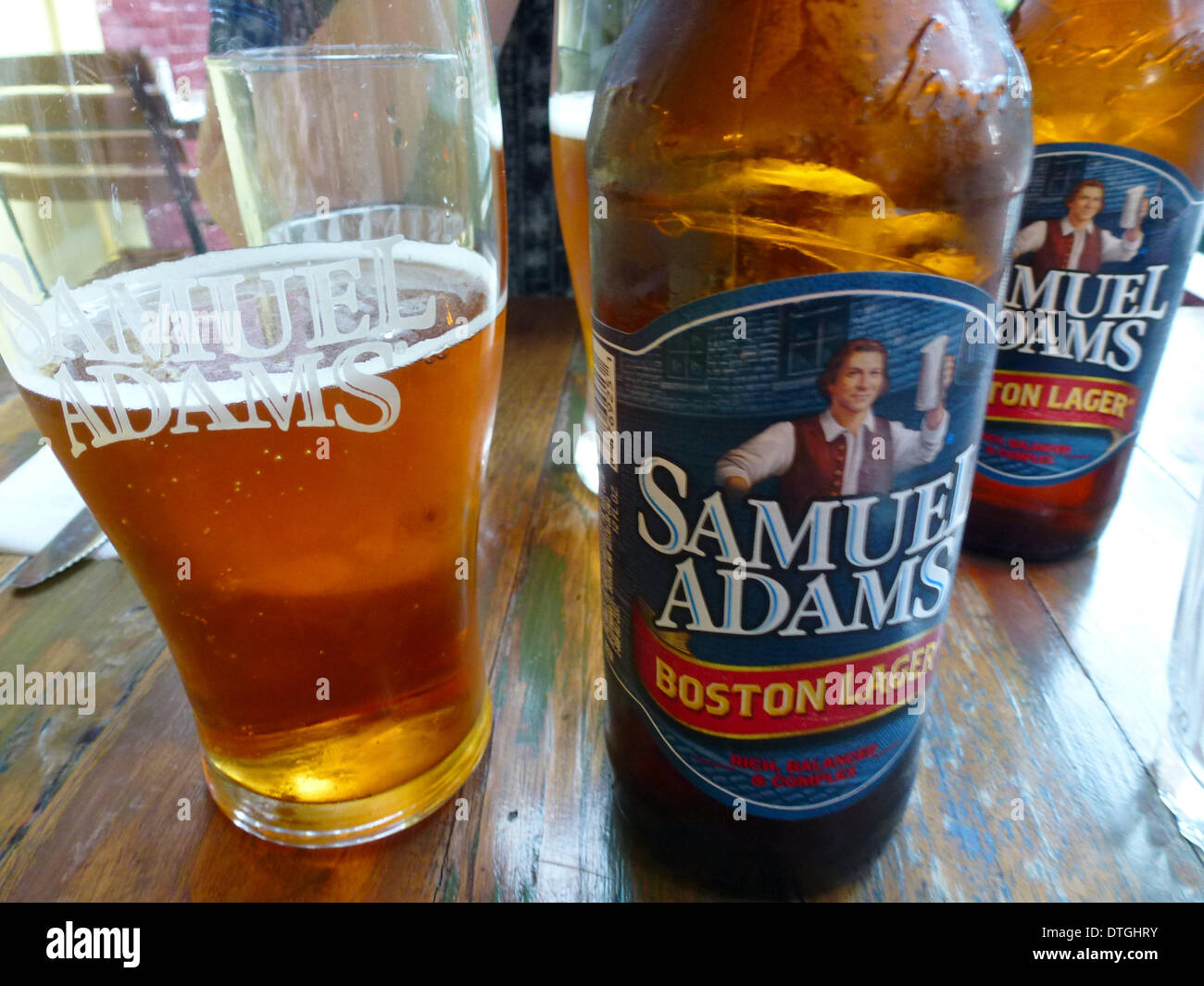New York, USA. 18th Aug, 2014. A glass and bottles of the beer brand ...