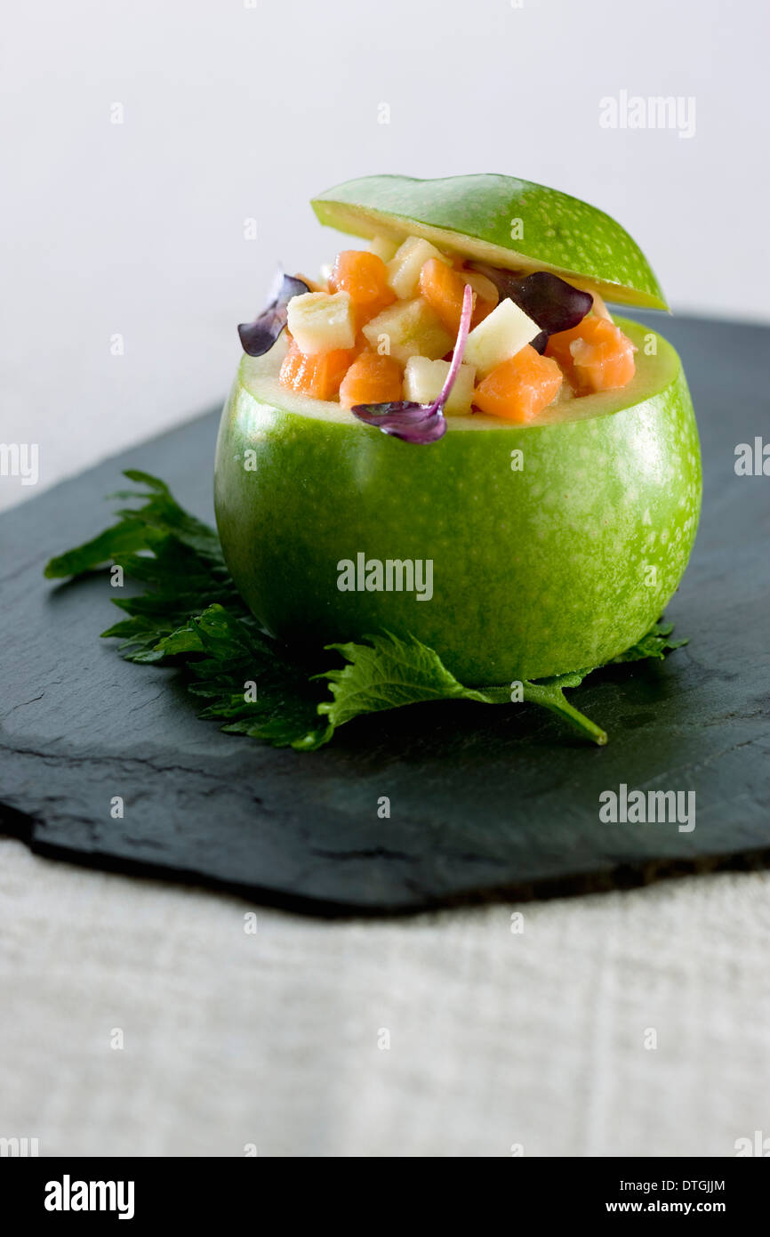 Salmon and apple tartare served in an apple Stock Photo - Alamy