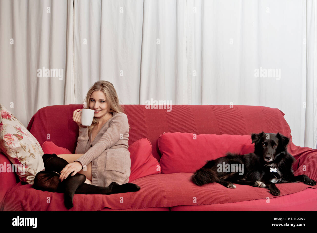 Woman drinking tea sitting on hi-res stock photography and images - Alamy