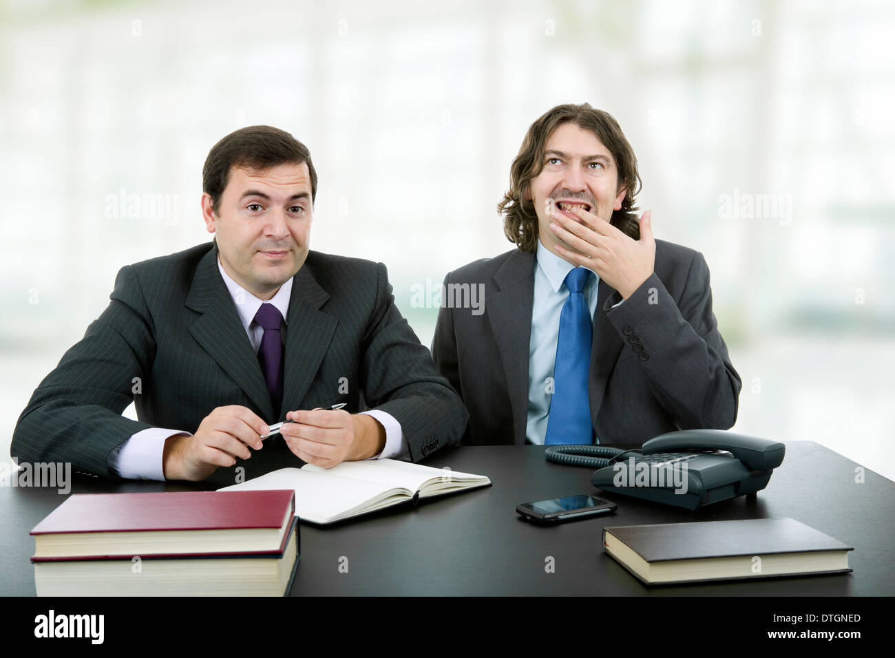 business team working at a desk at the office Stock Photo - Alamy