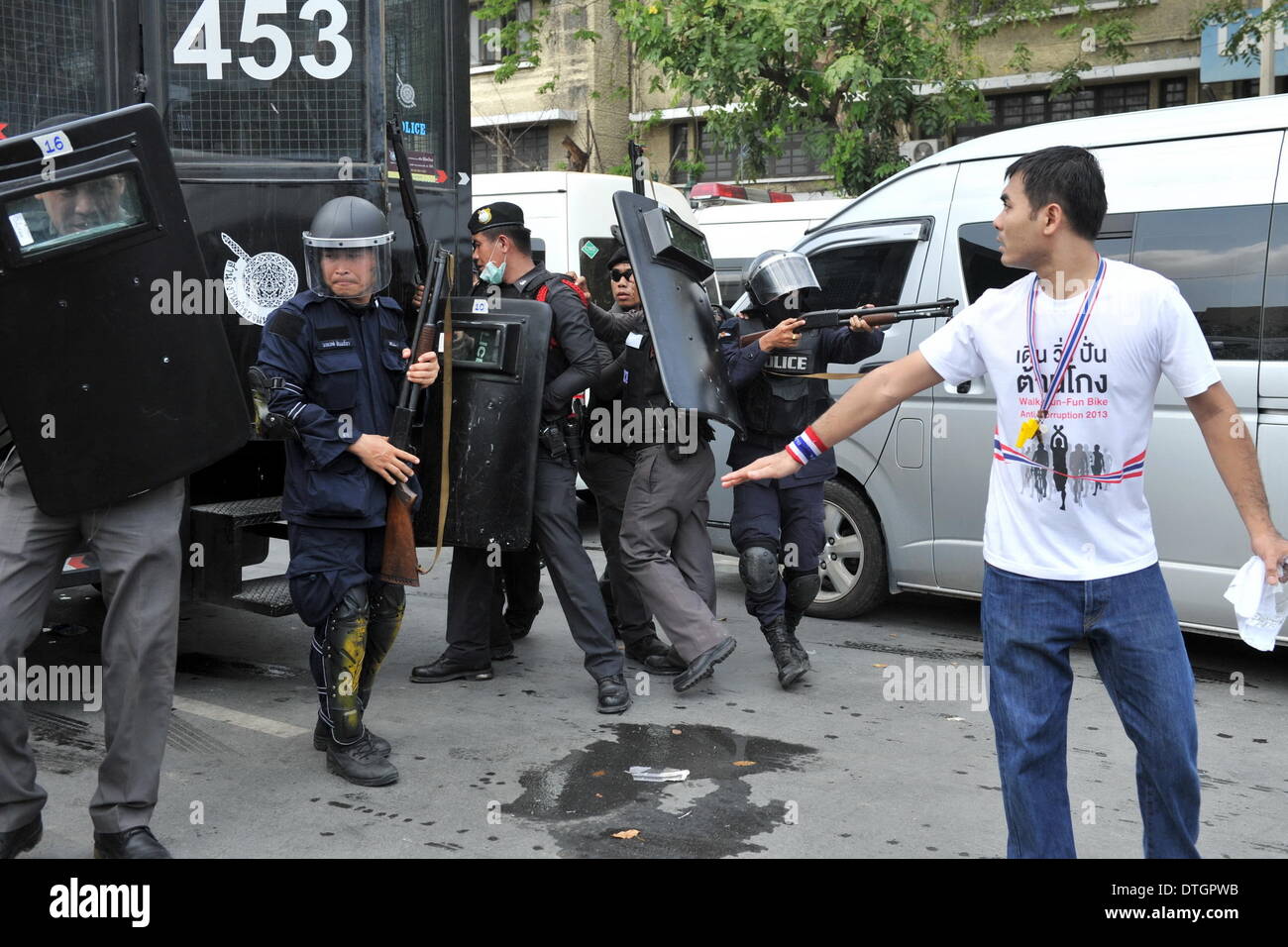 Bangkok, Thailand. 18th Feb, 2014. Thai riot police officers take cover ...