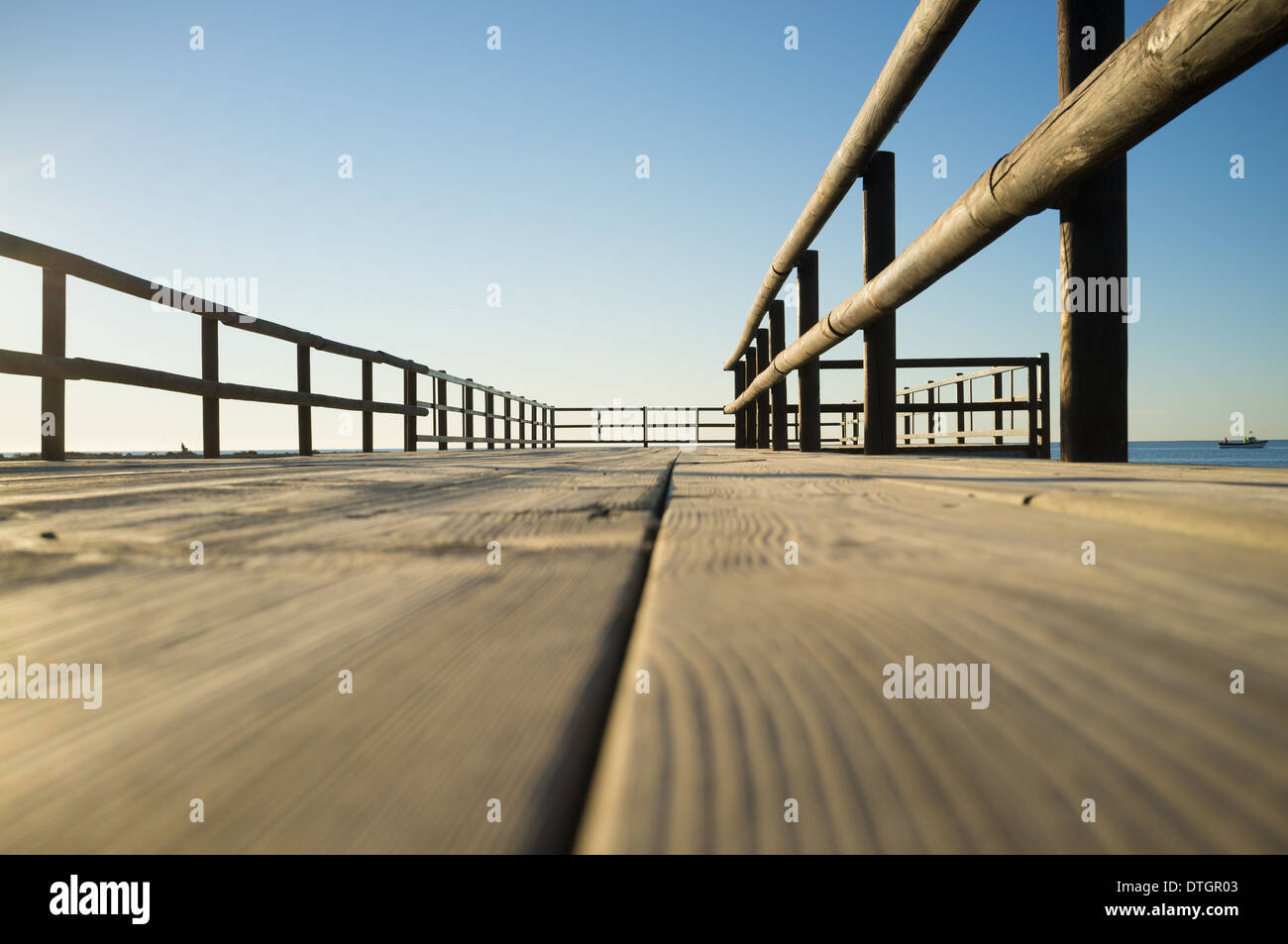 Low angle viewpoint of a wooden jetty Stock Photo - Alamy