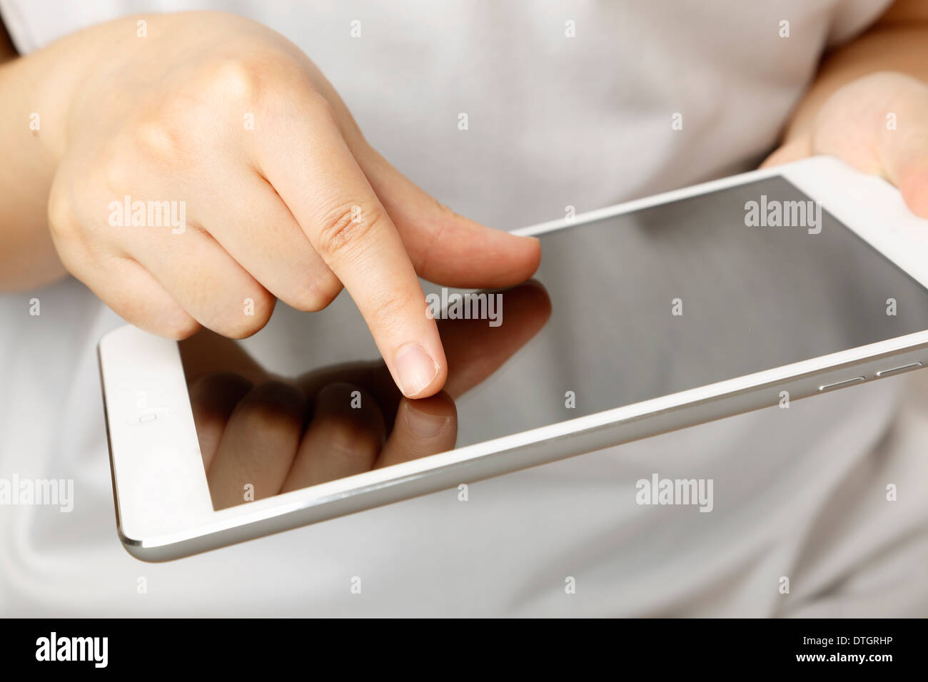 Young asian woman tablet hi-res stock photography and images - Alamy