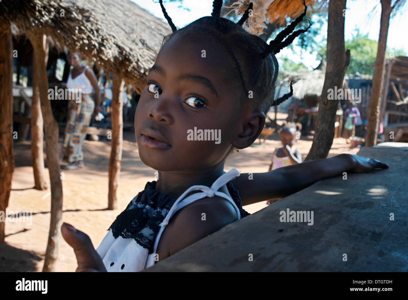 A girl with braids in Mukuni Village. Zabmia. The Mikuni Village is ...