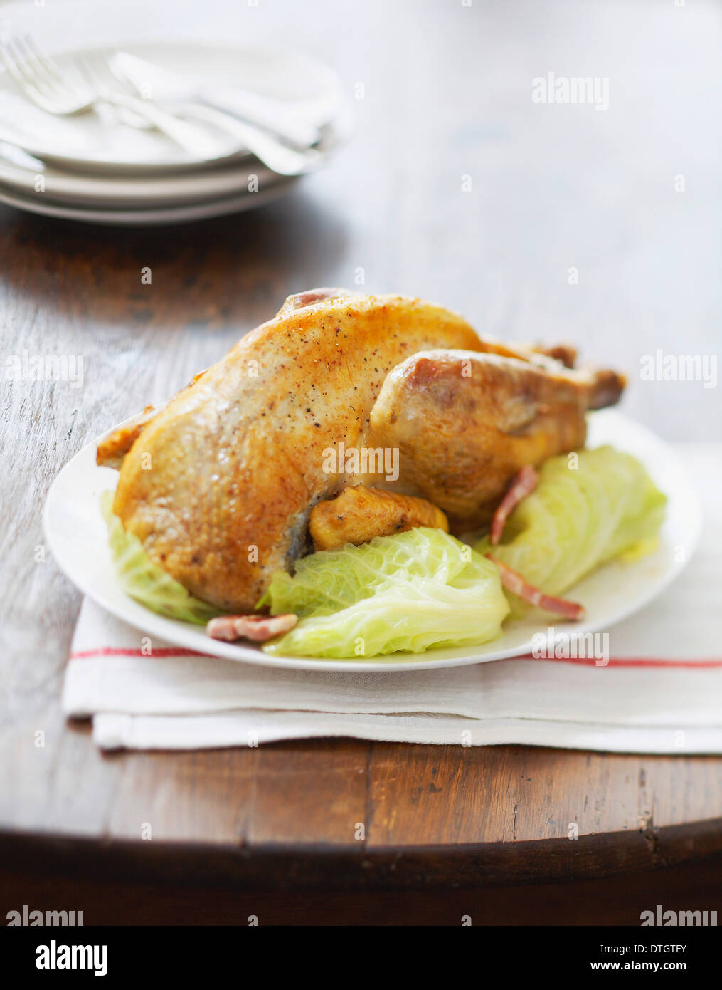 Roast guinea-fowl with cabbage Stock Photo - Alamy